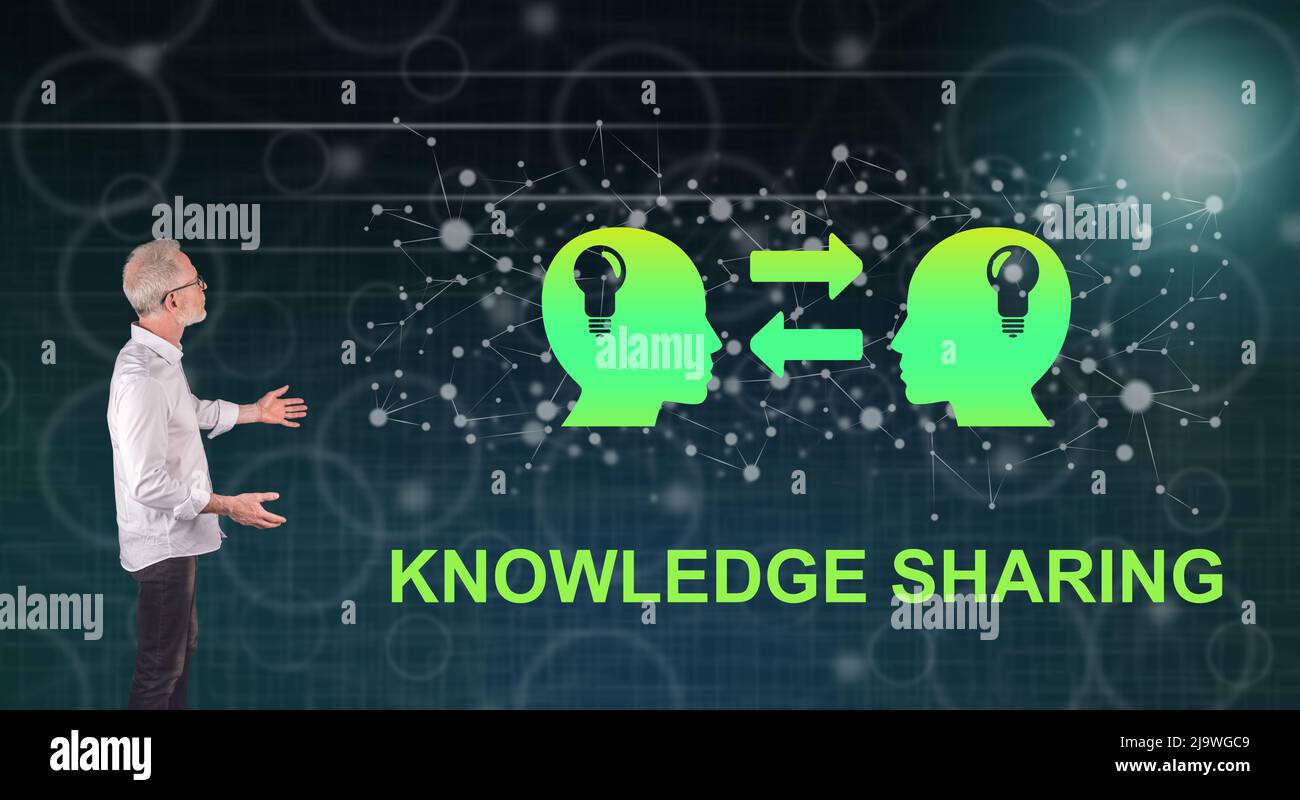 Businessman showing a knowledge sharing concept on a wall screen Stock ...