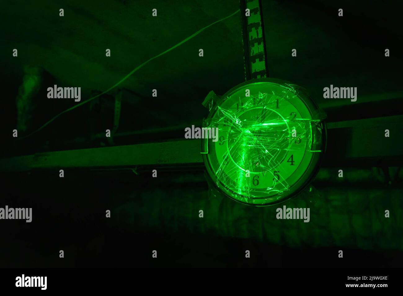 A damaged clock plastered with tape can be seen in the underground ...