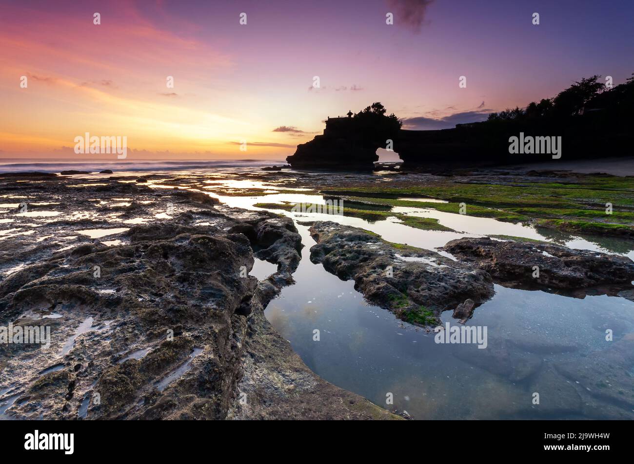 Sunset at Pura Batu Bolong Temple in Tanah Lot Bali Indonesia Stock ...