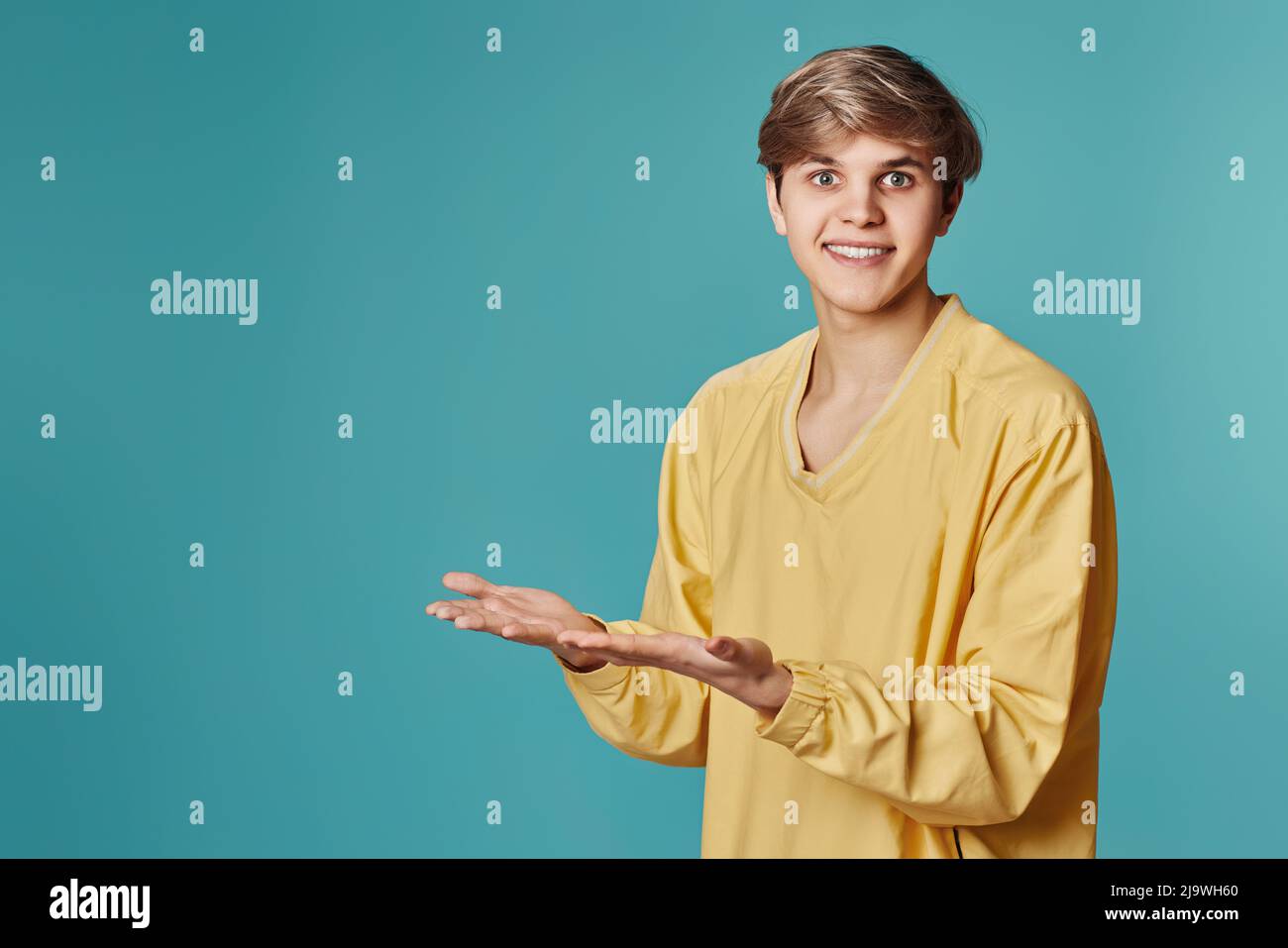 Happy presenter man pointing hi-res stock photography and images - Alamy