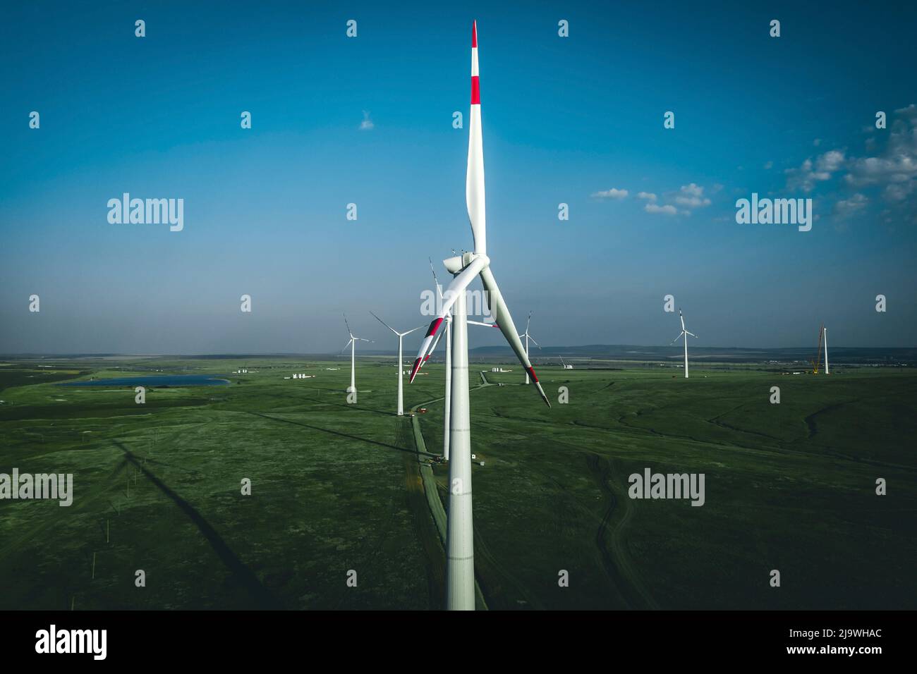 Wind Turbines Windmill Energy Farm with blue sky Stock Photo - Alamy