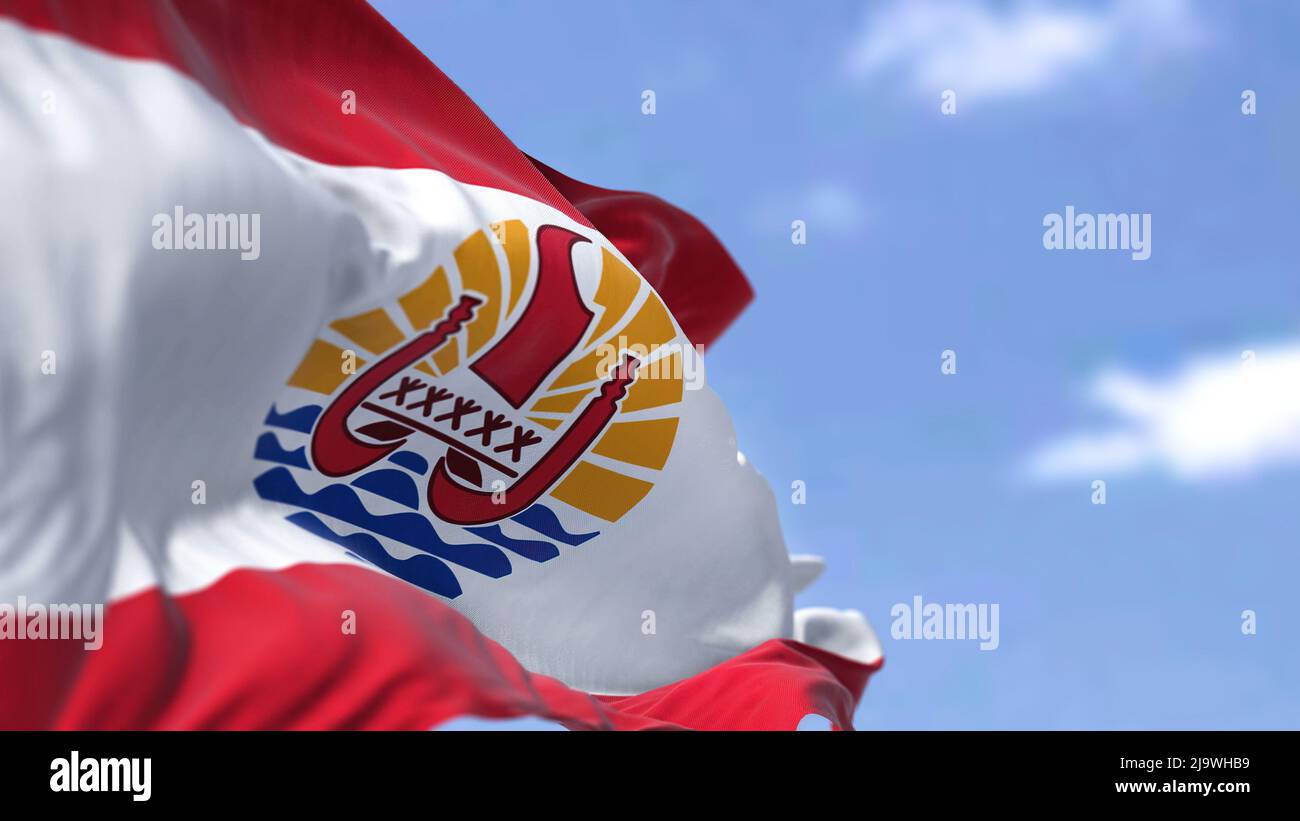 The flag of French Polynesia waving in the wind on a clear day. French ...
