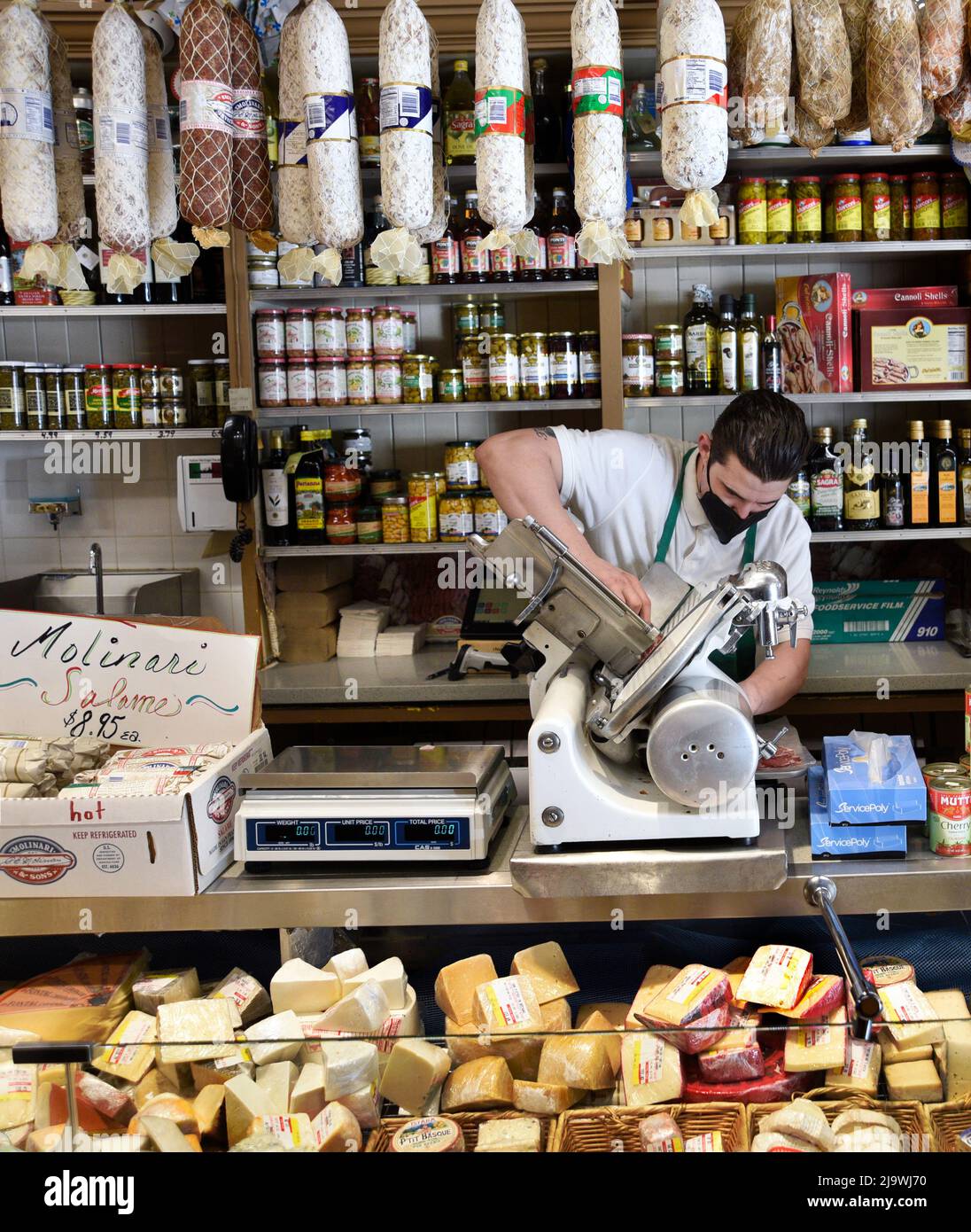 An employee makes sandwiches at the landmark Italian-American deli ...