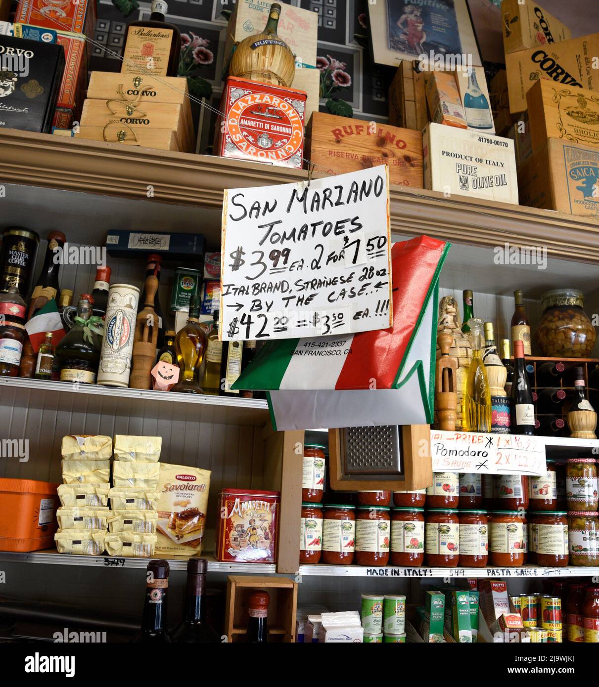 Shelves of Italian food products, including canned San Marzano tomatoes ...