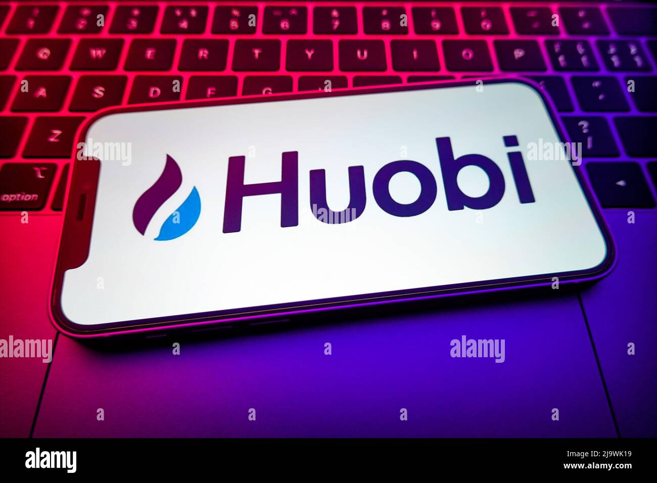 In this photo illustration, a Huobi logo is displayed on the screen of ...