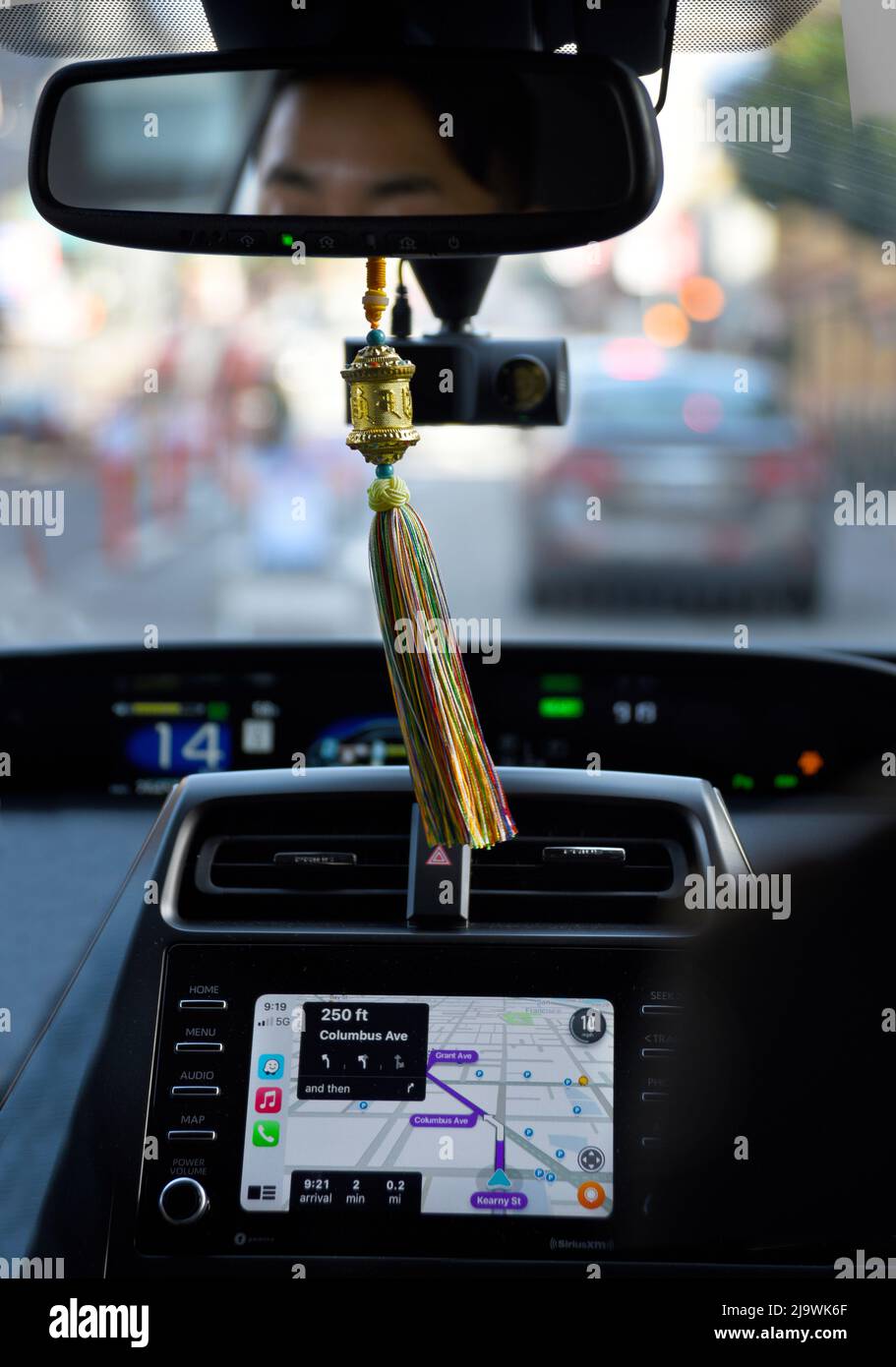 An Uber driver uses his car's GPS system to help him drive to his ...