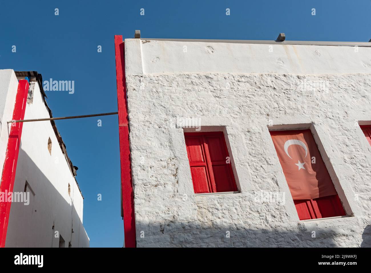 Graphic architecture and red shuttered windows of traditional buildings ...