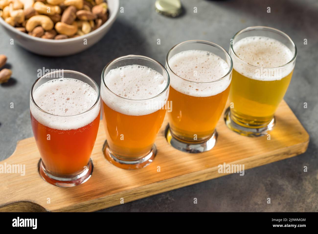 Cold Refreshing Sour Beer Flight with Cocktail Nuts Stock Photo - Alamy
