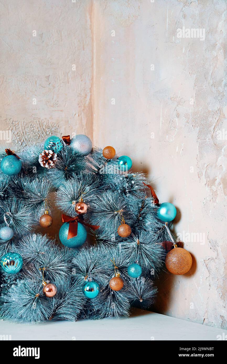 Christmas light blue wreath on a concrete wall background Stock Photo ...