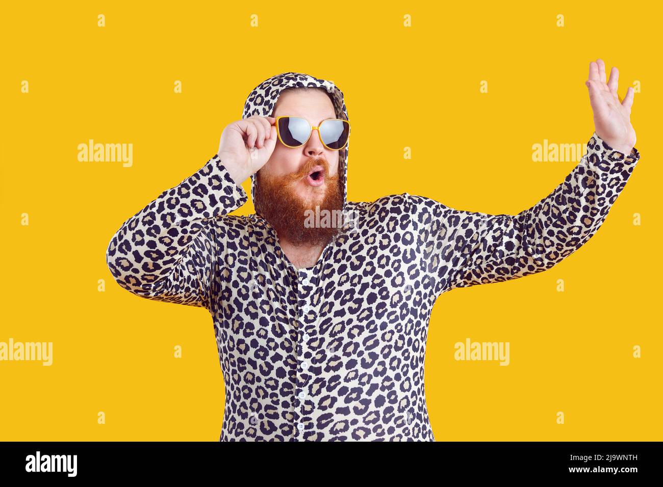 Portrait of funny comic chubby man who is strangely dressed and having ...