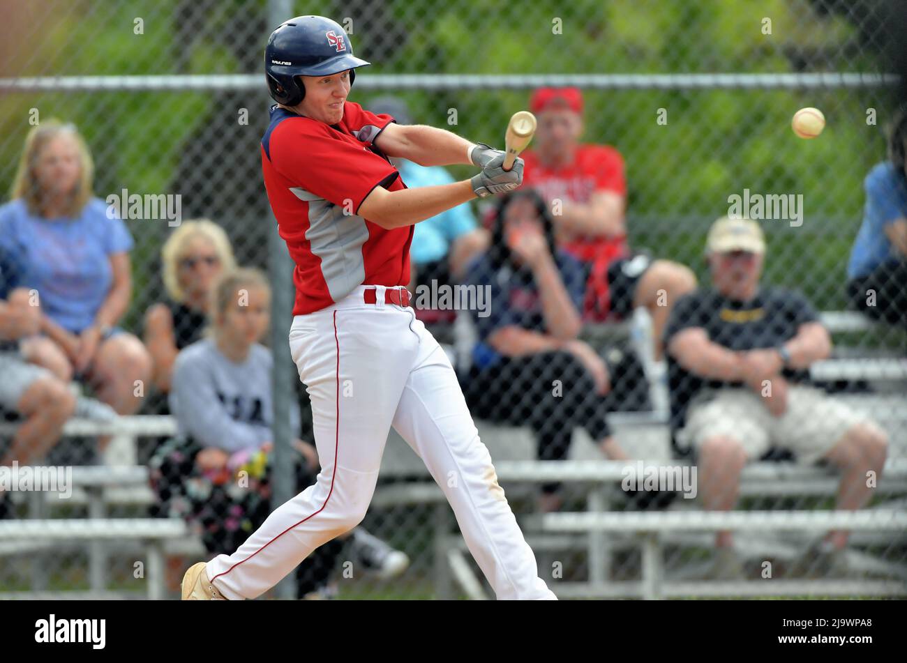 USA. Batter making contact with a pitch that resulted in a fly ball to ...