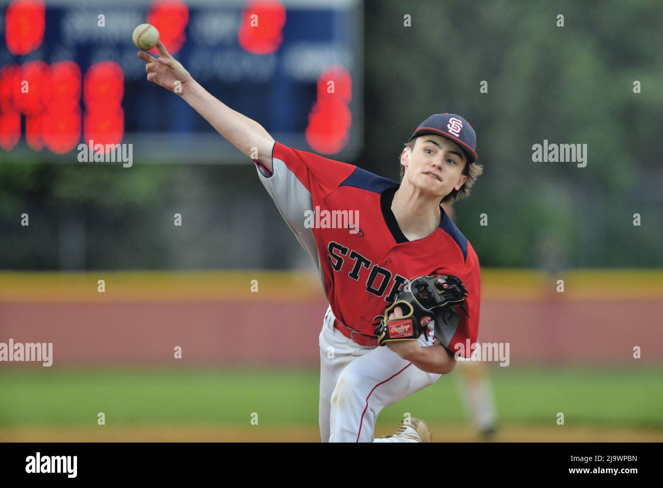USA. Pitcher delivering a pitch to a waiting batter during a high ...