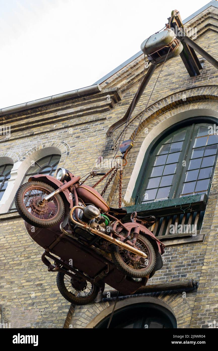 A suspended motorcycle at Christiania Free Town, Copenhagen, Denmark ...