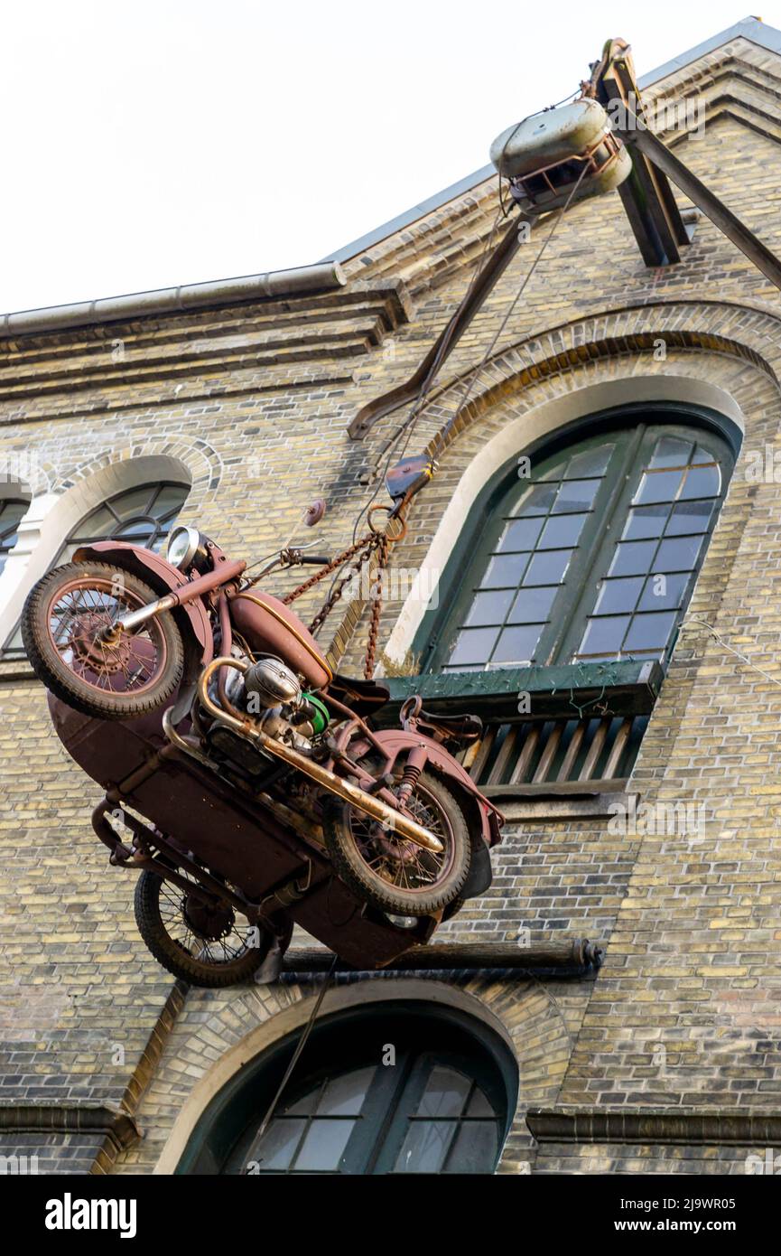 A suspended motorcycle at Christiania Free Town, Copenhagen, Denmark ...