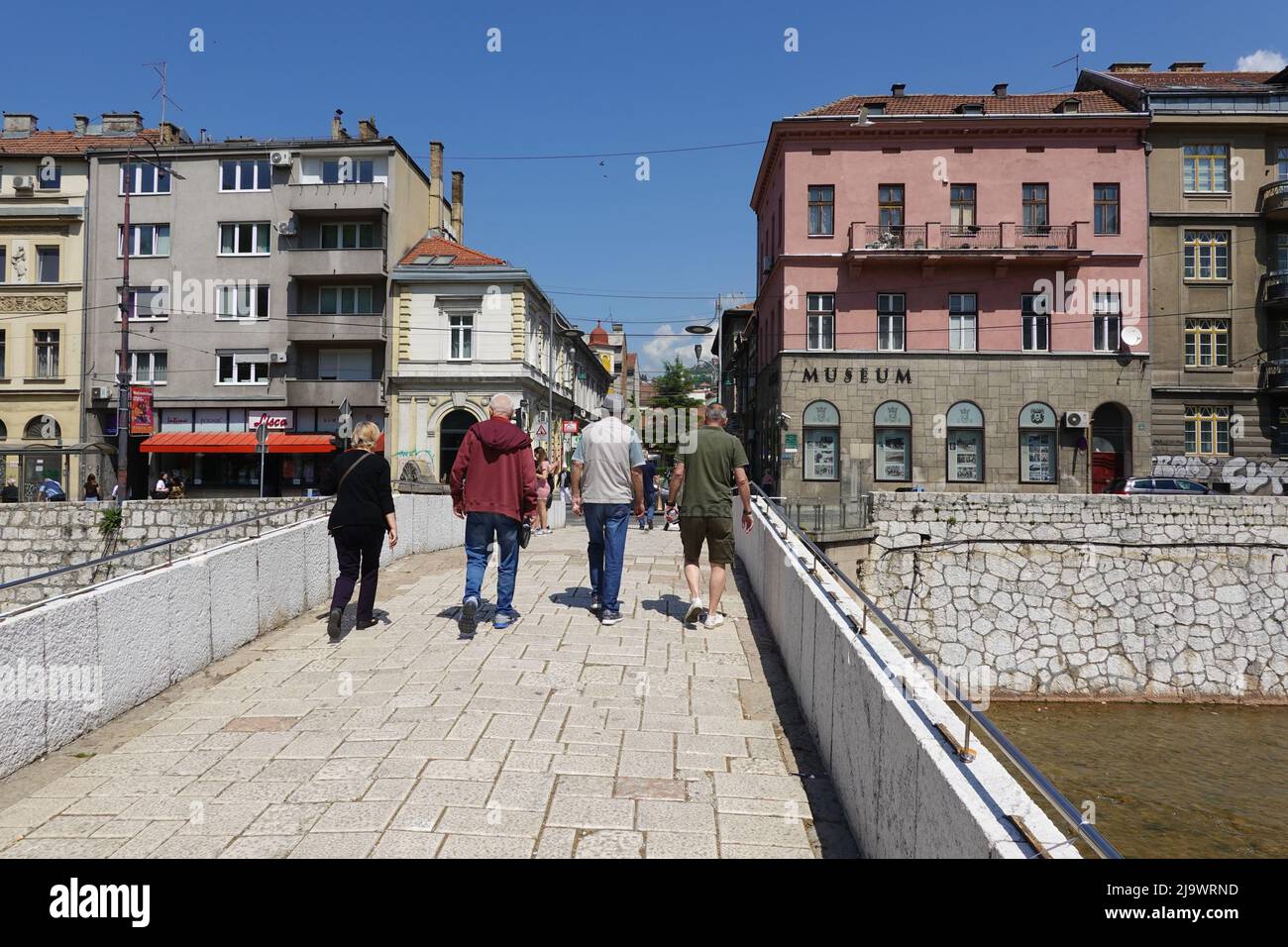 Pedestrians on the Latin Bridge, Sarajevo, walking towards the spot ...