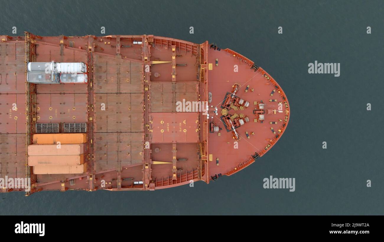 Aerial straight down view of the bow of an empty cargo ship at sea ...