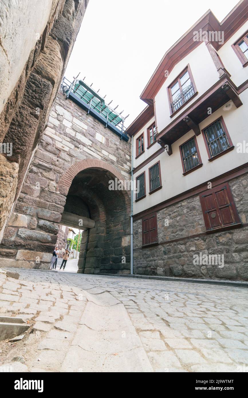 Traditional Turkish houses in Ankara Castle with entrance of the castle ...