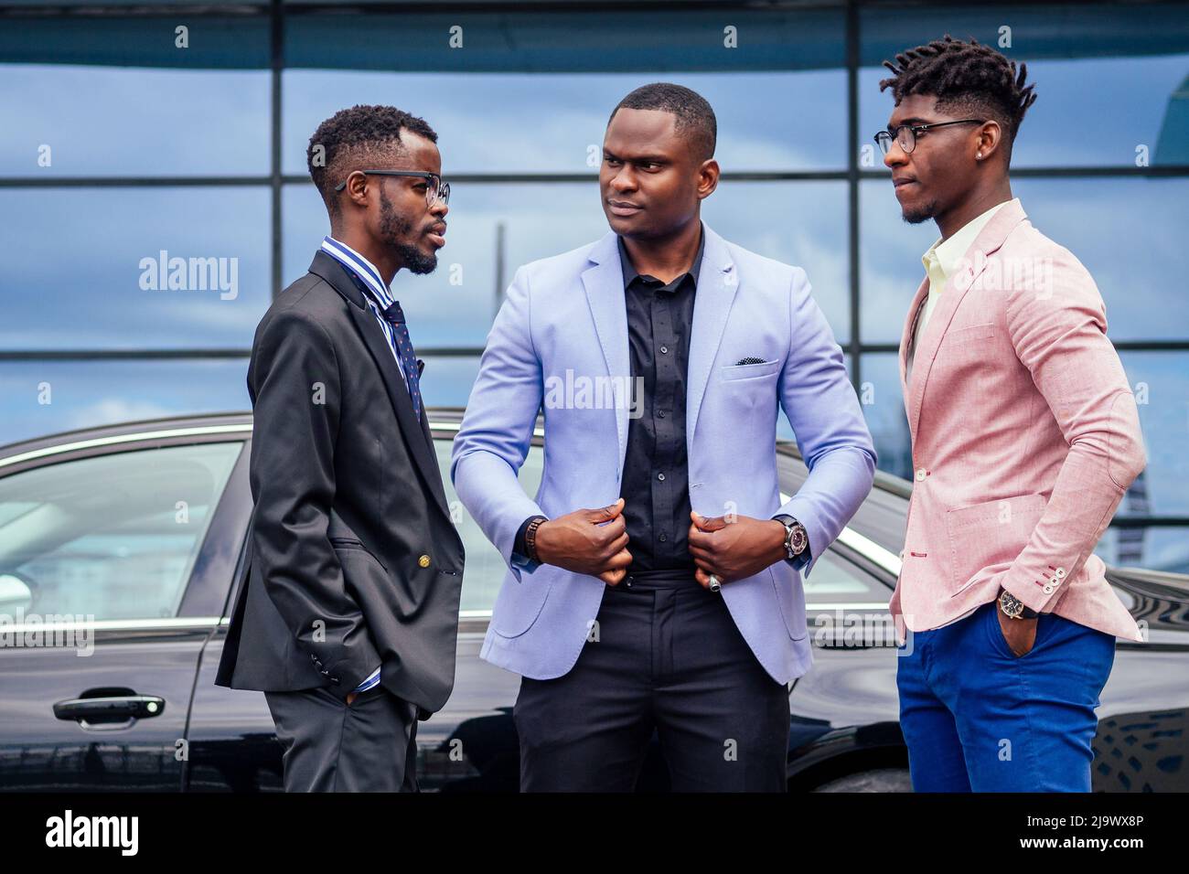 A group of three African Americans business men in stylish suits ...