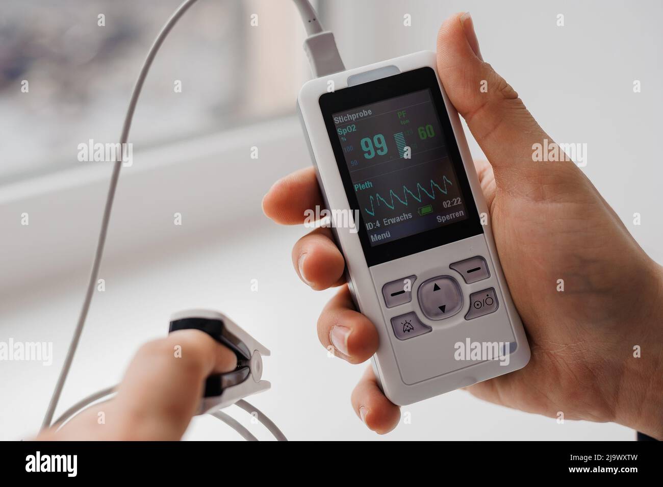 Man using finger pulse oximeter, healthcare monitoring concept. Pulse ...