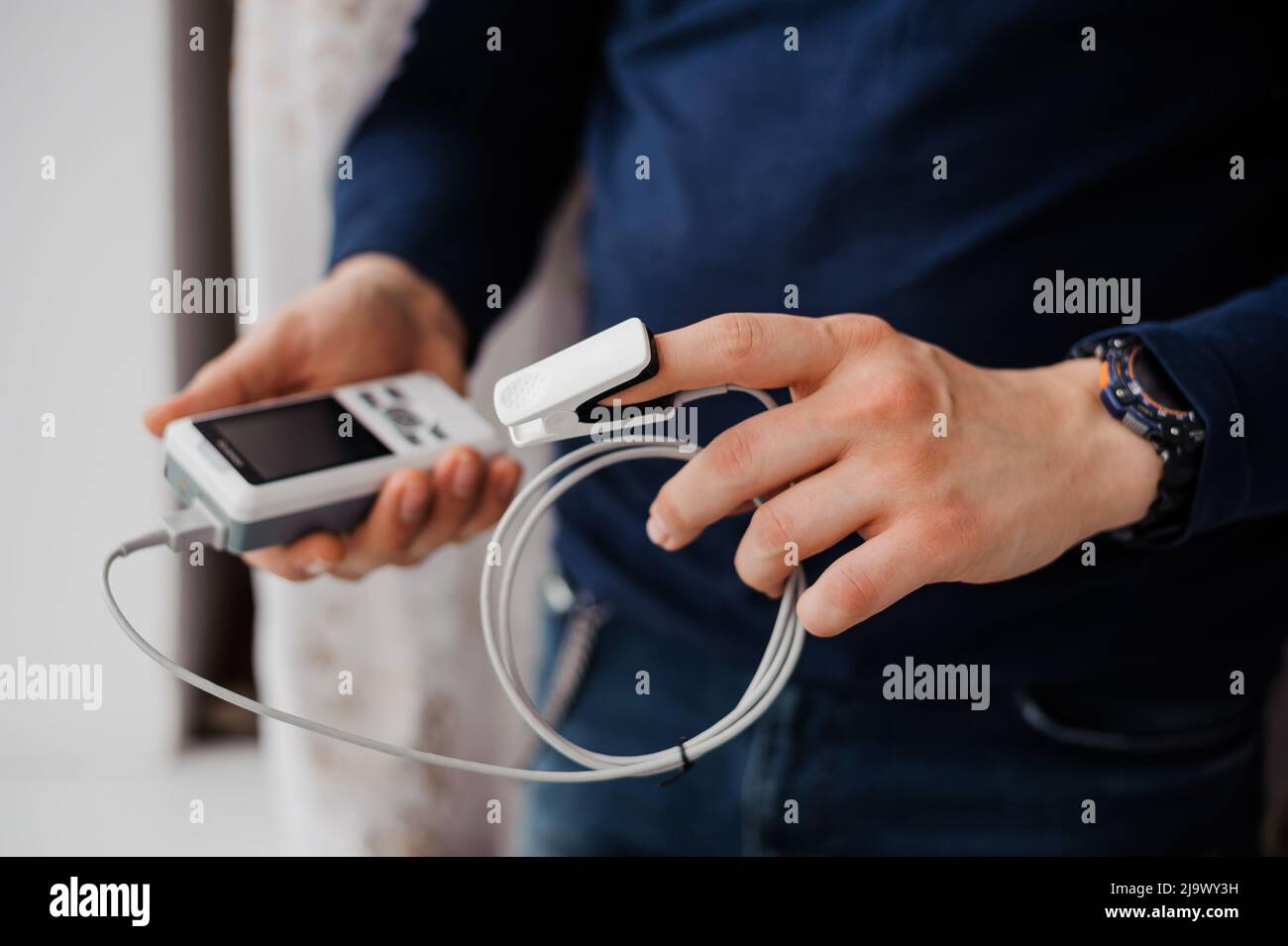 Man using finger pulse oximeter, healthcare monitoring concept. Pulse ...