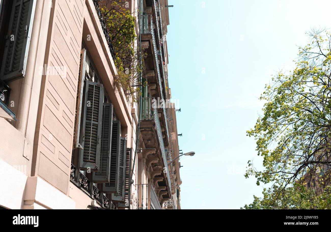 Classic apartment building with balconies and shutters in Barcelona ...