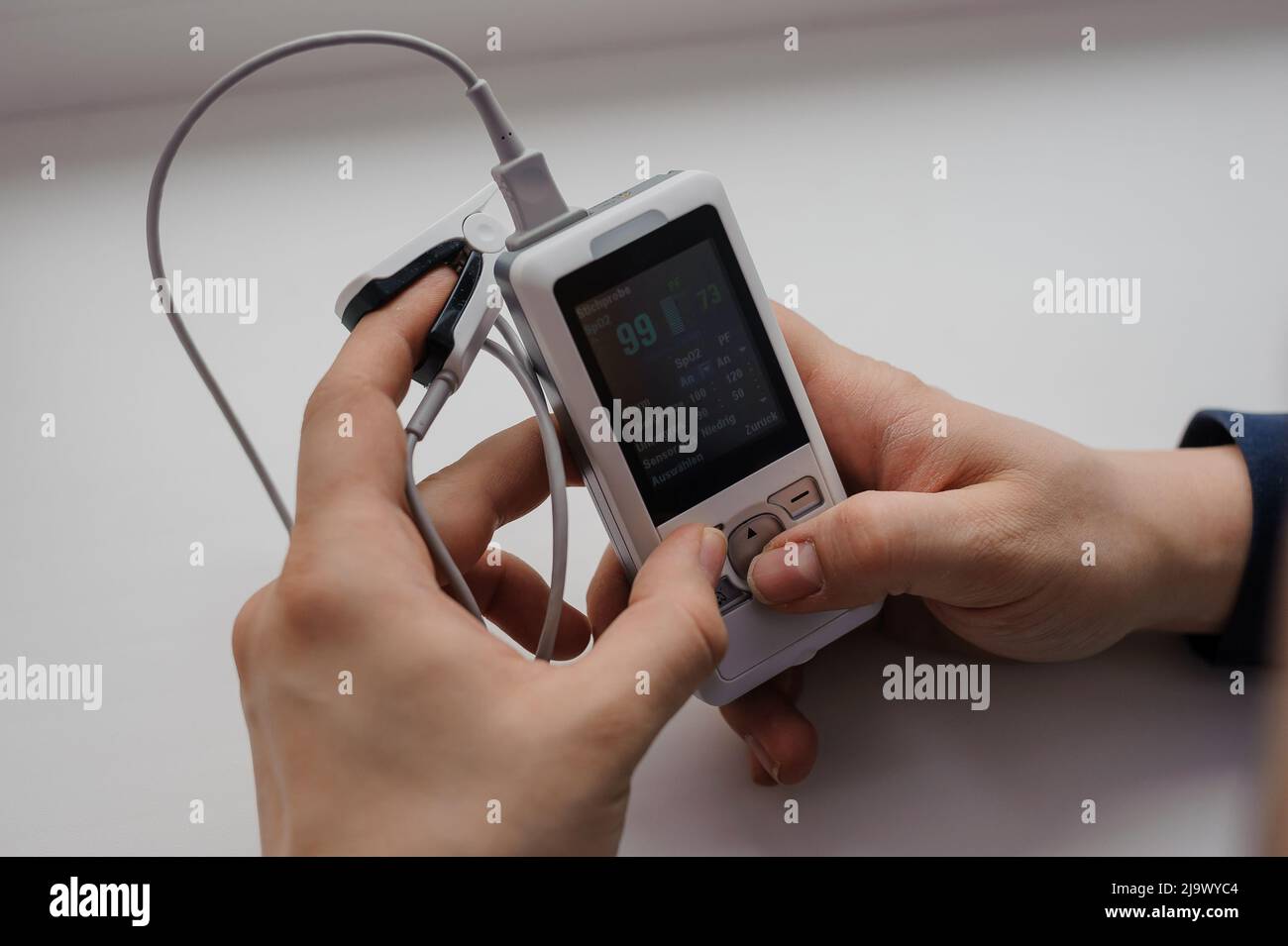 Man using finger pulse oximeter, healthcare monitoring concept. Pulse ...