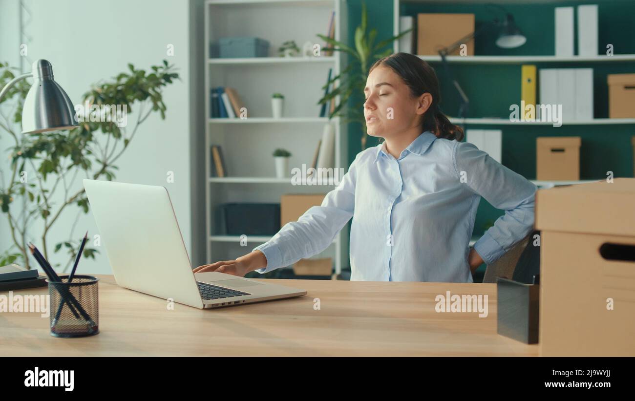 Woman Trying to Get Up From the Table Suddenly Feeling Pain in Back ...