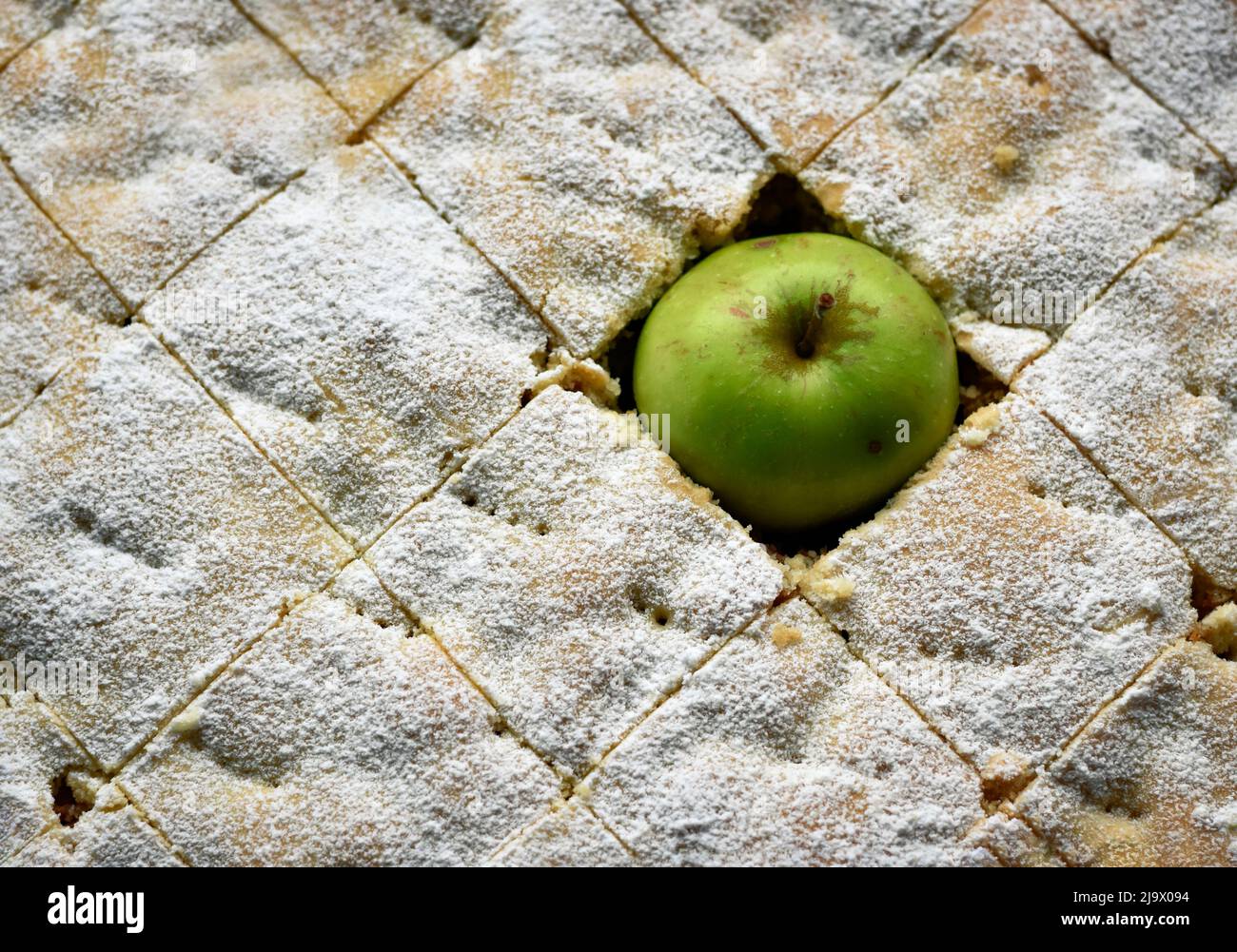 abstract food background Green apple hidden in a cake Stock Photo - Alamy