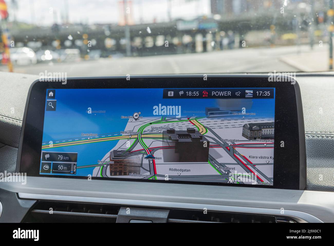 Close up view of navigation monitor in car showing direction of traffic ...