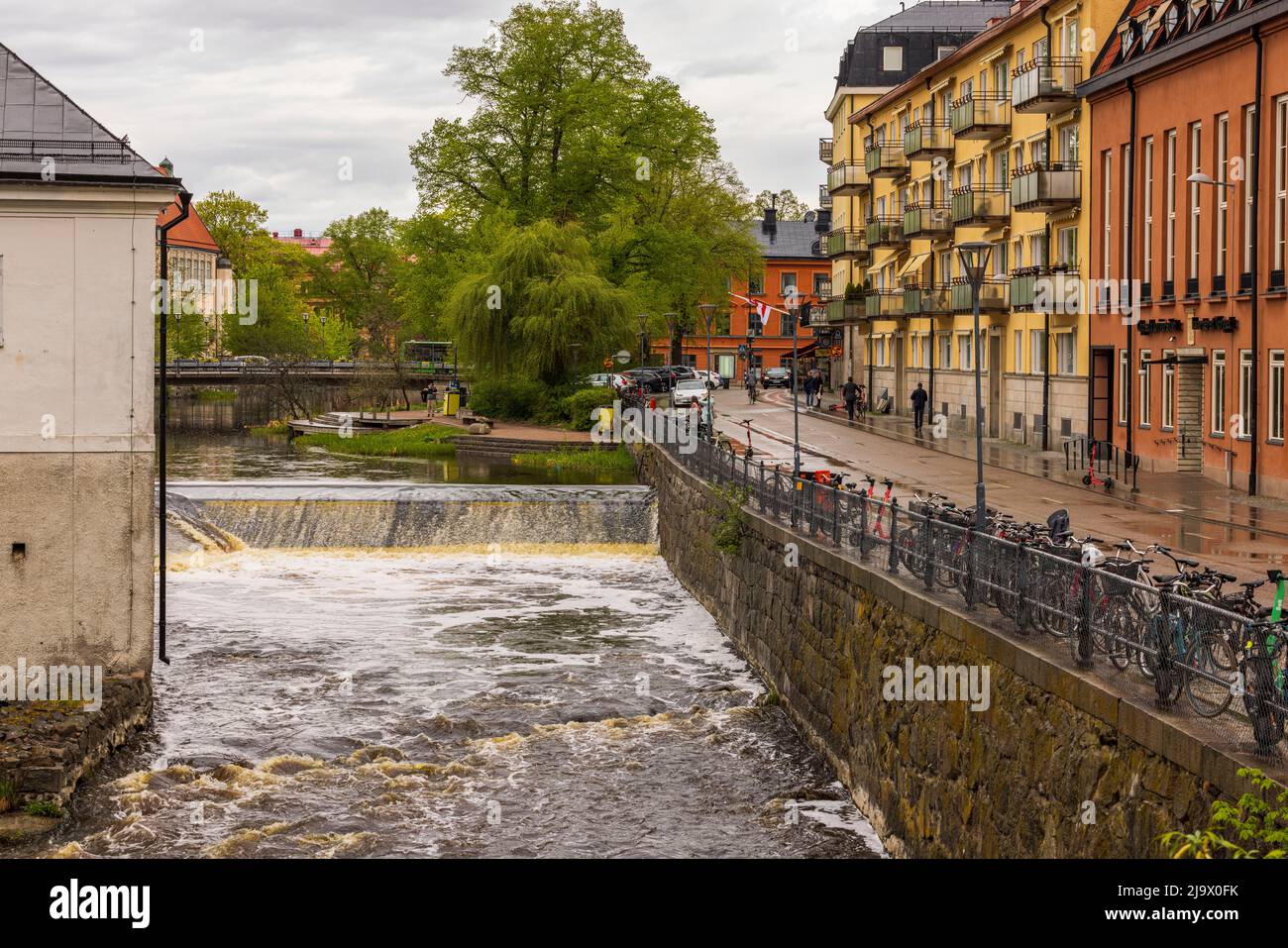 Beautiful view of historic city center with old buildings and flowing ...