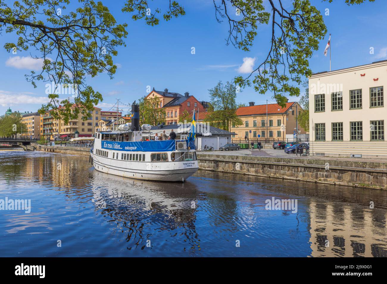 Beautiful view of white tourist excursion boat on cityscape background ...