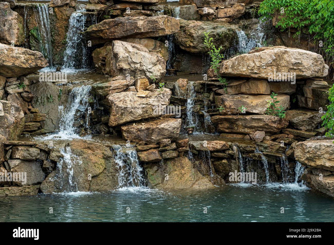 landscape design, a dam with a cascade of waterfalls in the form of ...