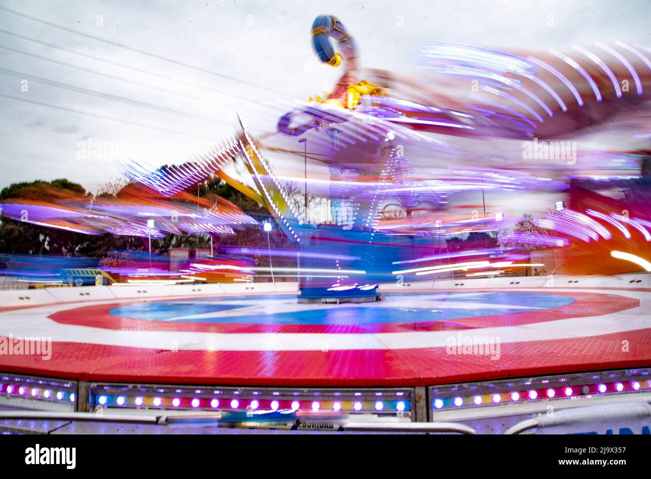 Hilarious fairground attractions, with lights of different colors ...