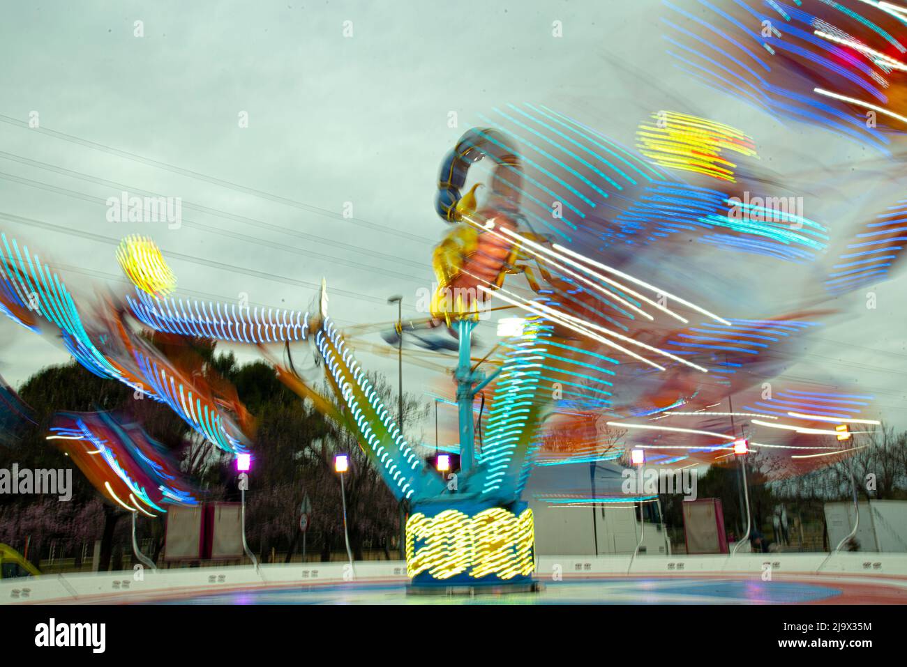 Hilarious fairground attractions, with lights of different colors ...