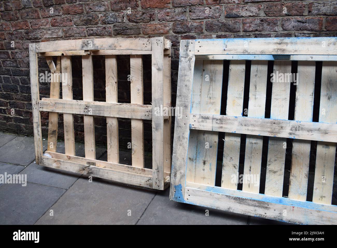 UK pallets on street alley Stock Photo - Alamy