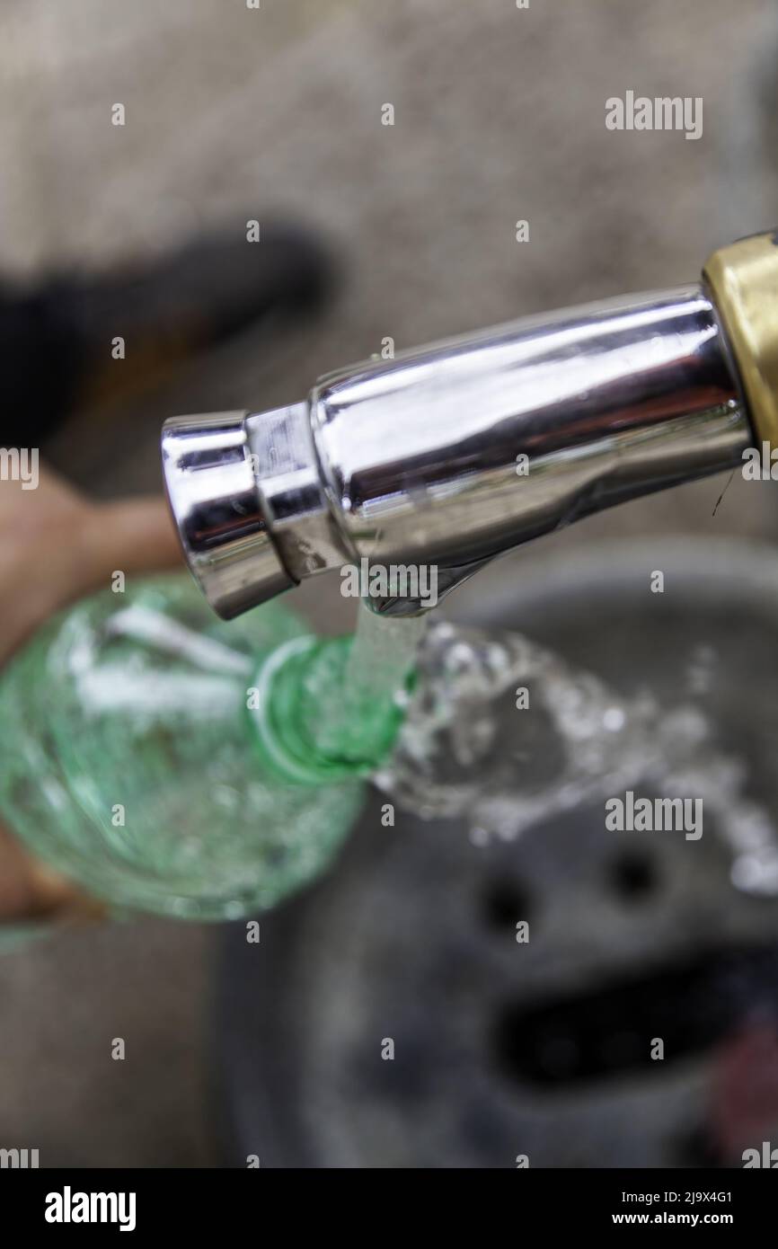 Filling water bottle in fountain, water and summer, refreshment Stock ...
