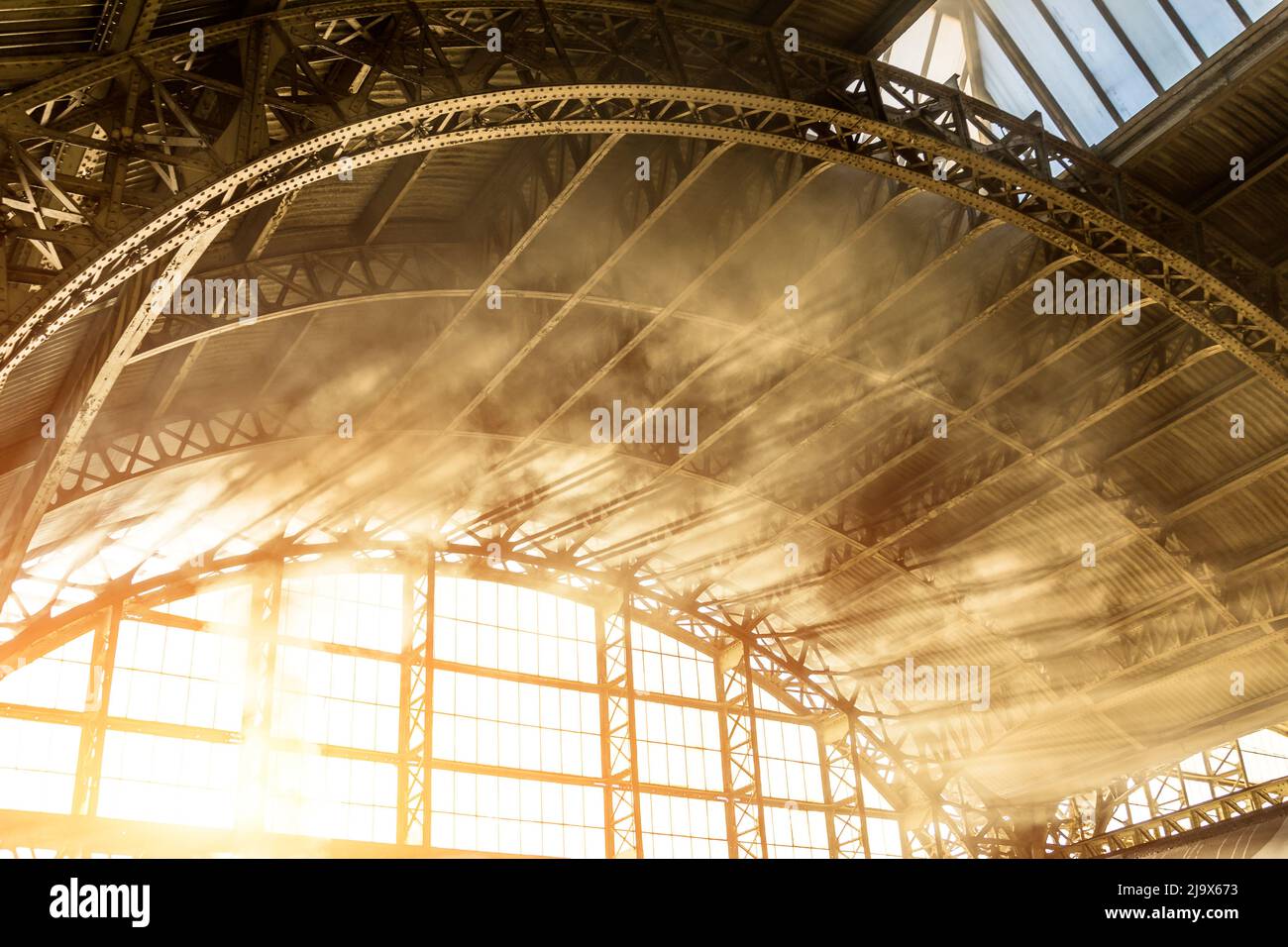 Smoke and park in the morning rays of a metal retro roof arch Stock ...