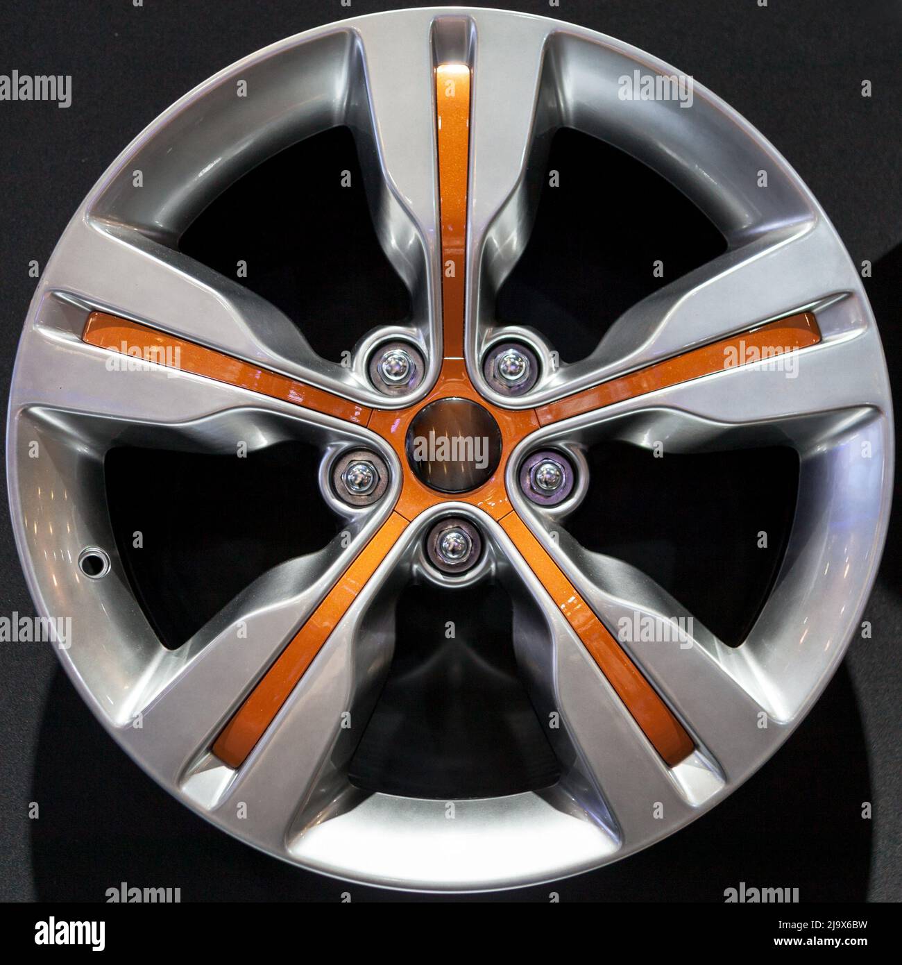 Car alloy rim on black background Stock Photo - Alamy