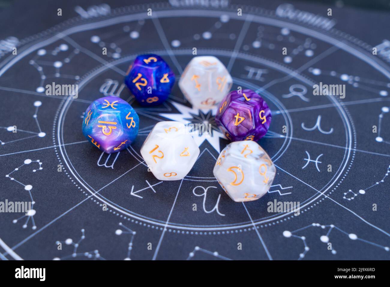 Zodiac horoscope with divination dice Stock Photo - Alamy