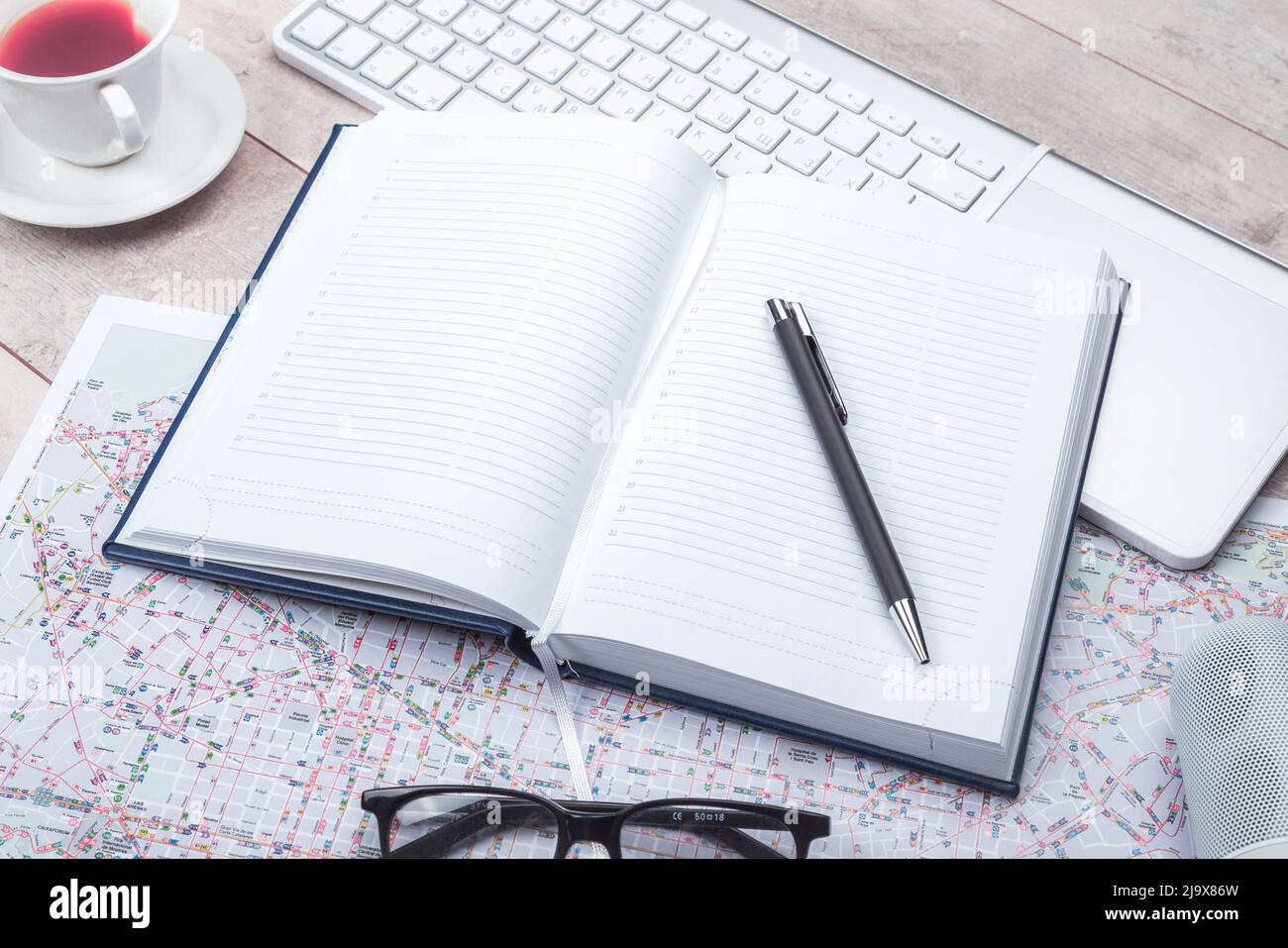 Diary notepad with accessories on table Stock Photo - Alamy