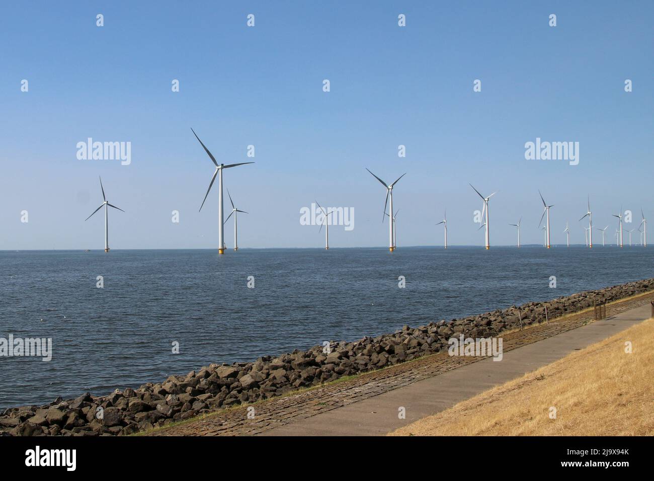 Modern wind turbines in the Noordoostpolder in the Netherlands for ...