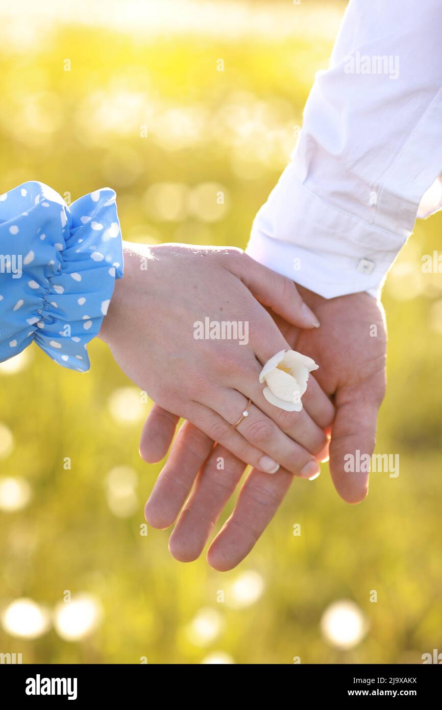 romantic date concept. young man and woman hands holding each other ...