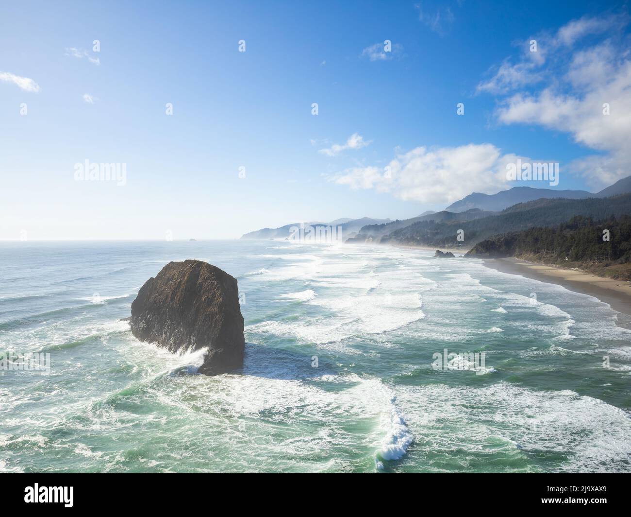 Beautiful seascape. Big rock in the ocean. In the distance you can see ...