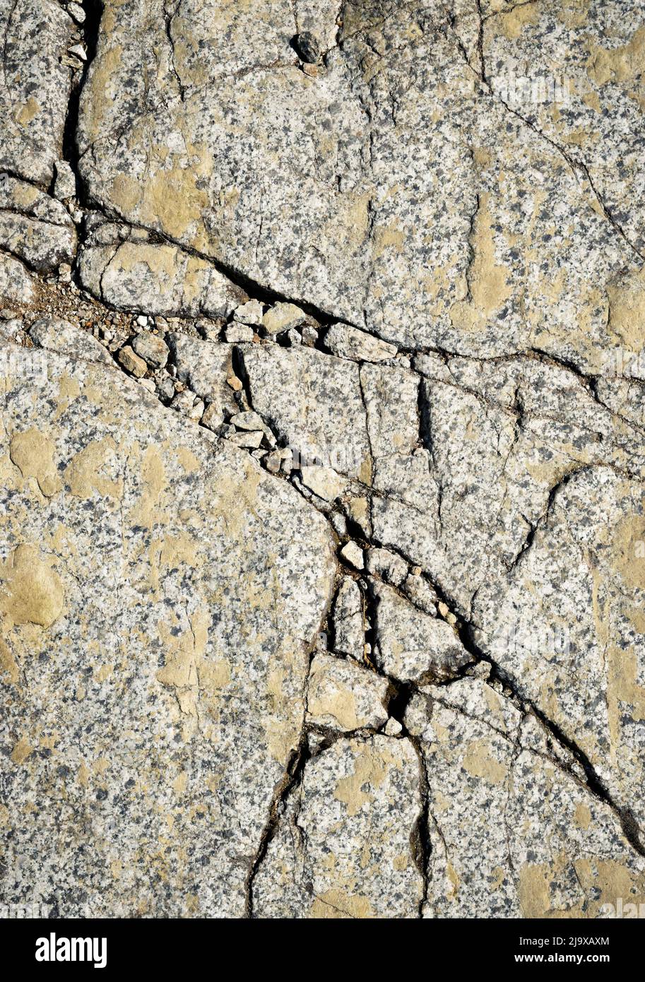 nature background or texture fissured surface of granite rocks Stock ...