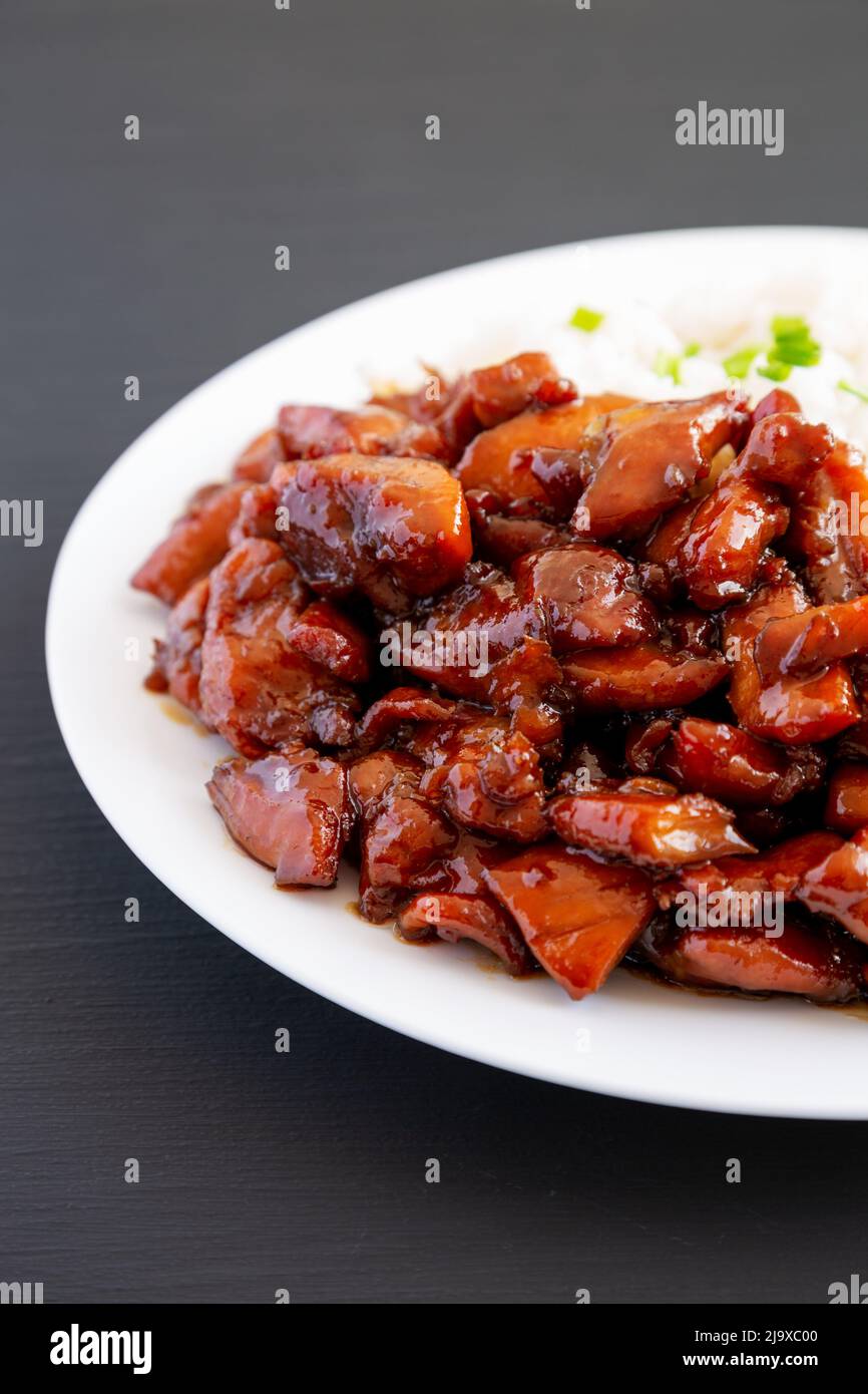 Homemade Teriyaki Chicken with White Rice on a Plate on a black ...