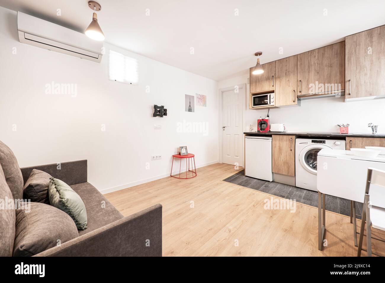 Studio apartment with open kitchen, living room with folding sofa bed ...