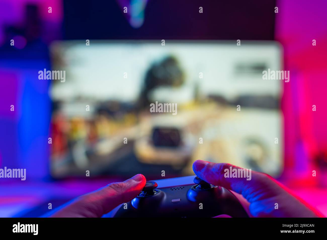 Video games. On a technological background, a joystick in the hands of ...