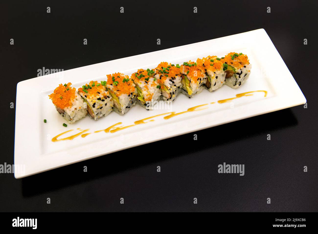 Sushi uramaki california roll with masago roe with avocado and salmon ...