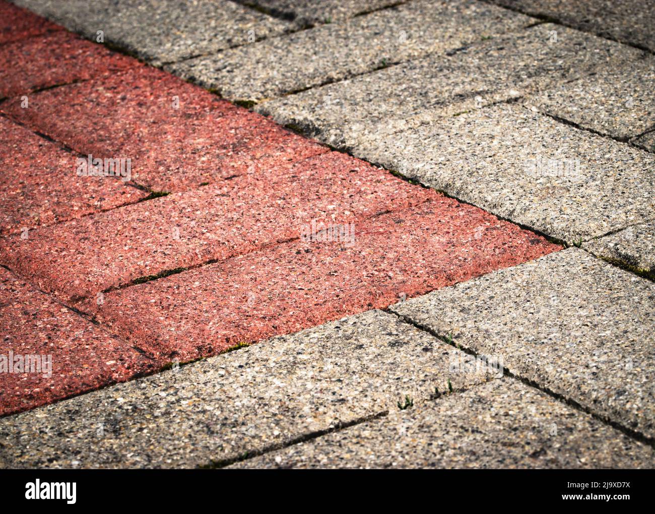detail of old concrete pavement red and gray Stock Photo - Alamy