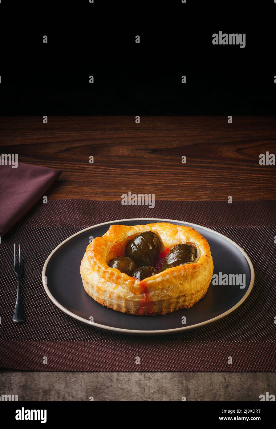 View of a puff pastry bread, fine pastry. Fig and puff pastry tart. The ...